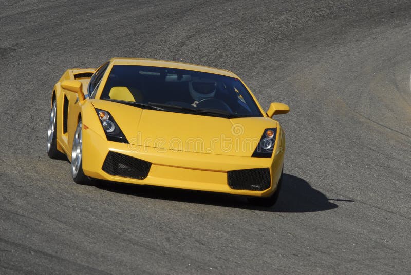 Yellow Sportscar on Banked Track Stock Photo - Image of horsepower ...