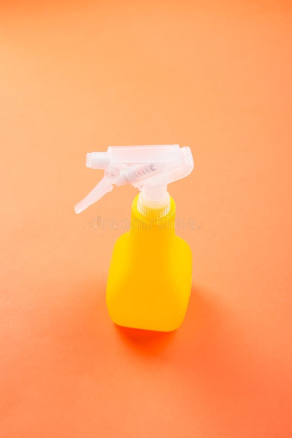 Yellow Spray Bottle for Cleaning on Orange Stock Image - Image of ...
