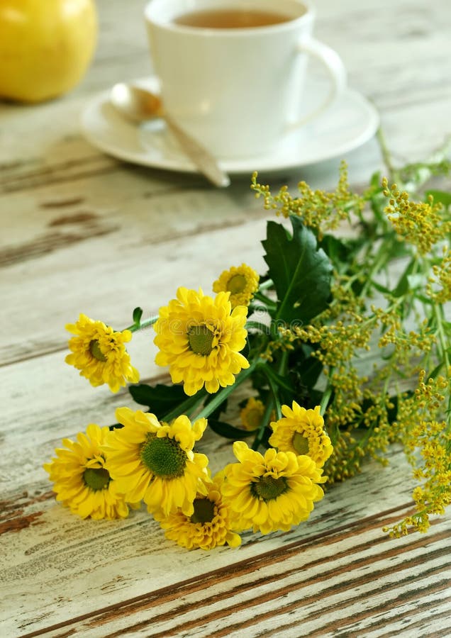 Yellow Spring Flowers and Cup of Tea on Old Wood Stock Image - Image of ...