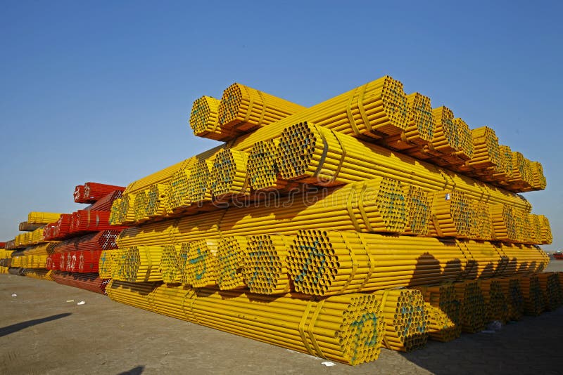 Yellow stacked steel pipe stock image. Image of stainless - 225825409