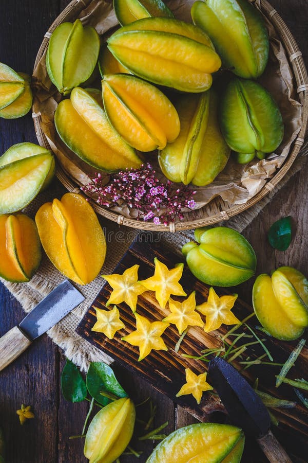 Yellow Star fruits stock photo. Image of leaf, knife - 75336990