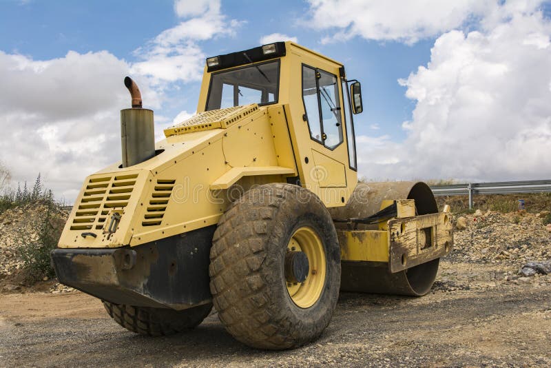 Yellow Steamroller Doing Road Construction Work Stock Image - Image of ...