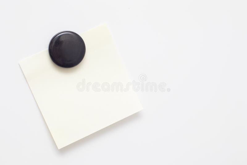 Yellow Sticker Attached Black Magnet on White Fridge Stock Image ...
