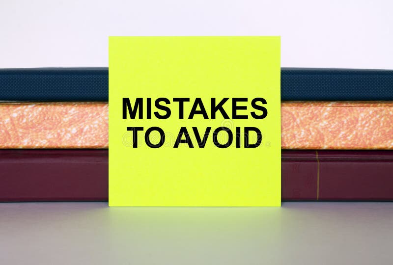 Yellow Sticker with Text Mistake To Avoid on a Stack of Notebooks Stock ...