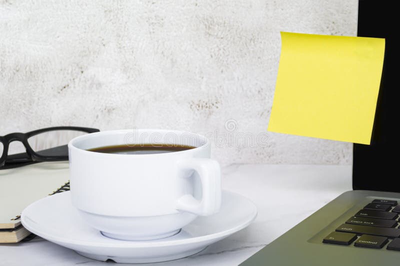Yellow Sticky Note on a Notebook with Coffee, Notepad and Reading Glass ...