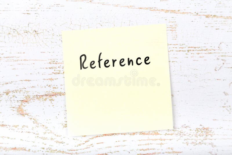 Yellow Sticky Note on Wooden Desk with Handwritten Text Reference Stock ...