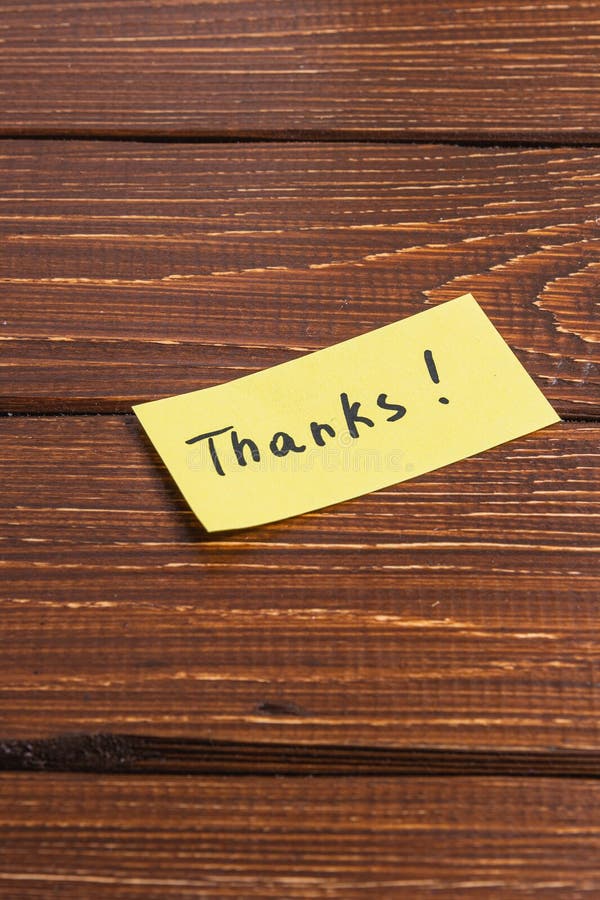 Yellow Sticky Note with the Word Thanks Written on it. Stock Photo ...