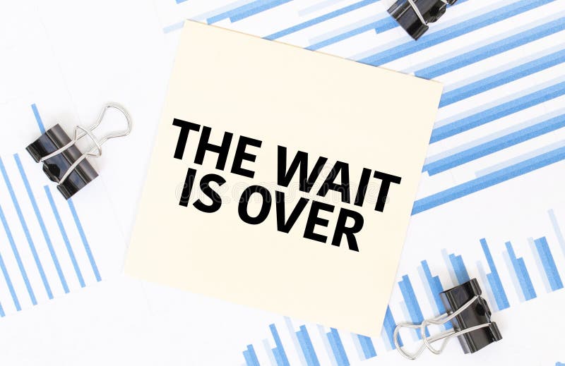 Yellow Sticky Notes with Text the Wait is Over on the White Office Desk ...