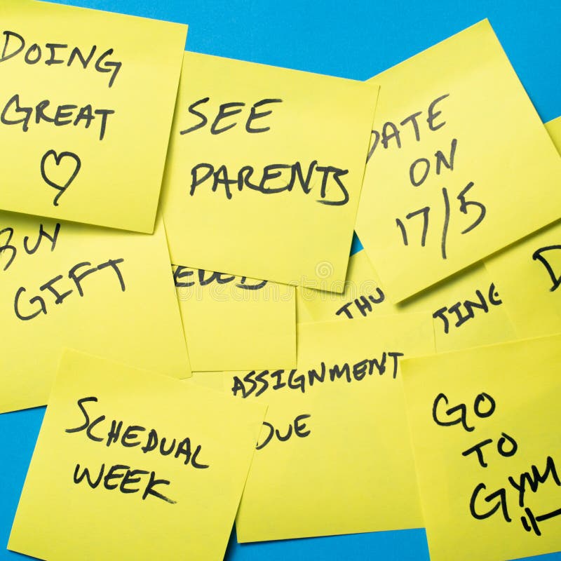 Yellow Sticky Notes with Writing on Blue Background Stock Image - Image ...