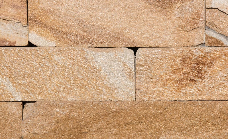 The Yellow Stone is Carved with Brick-shaped Plates in Bright Sunlight ...