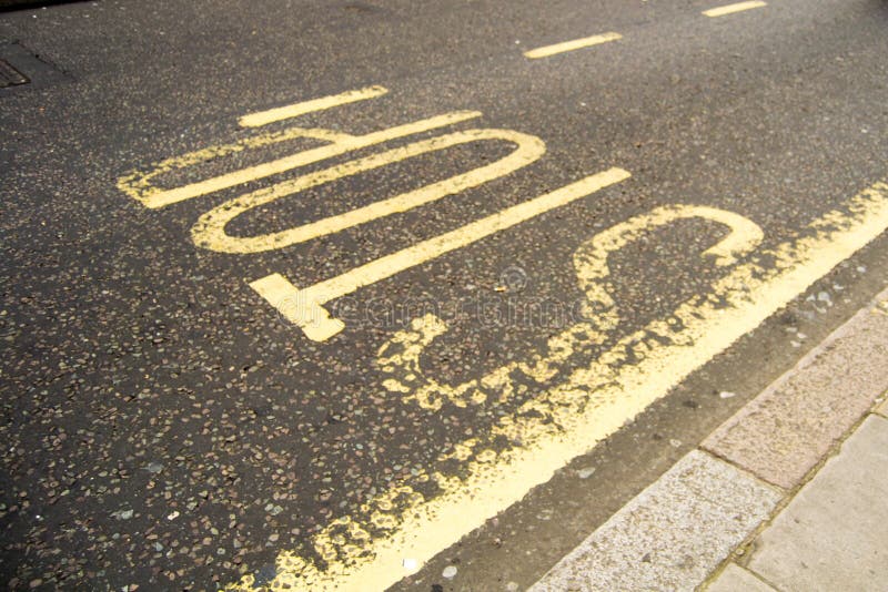 Yellow STOP Letters on the Asphalt Stock Photo - Image of stop, street ...