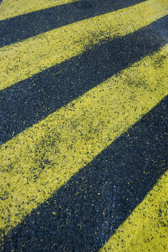 Yellow stripes on asphalt stock photo. Image of details - 6922214