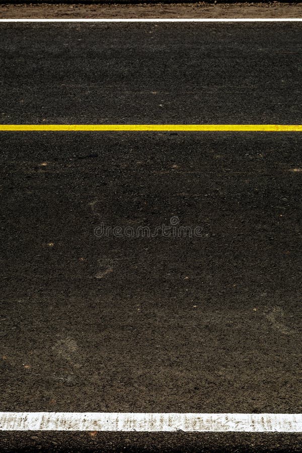 Yellow stripes on the road stock photo. Image of sign - 52106734