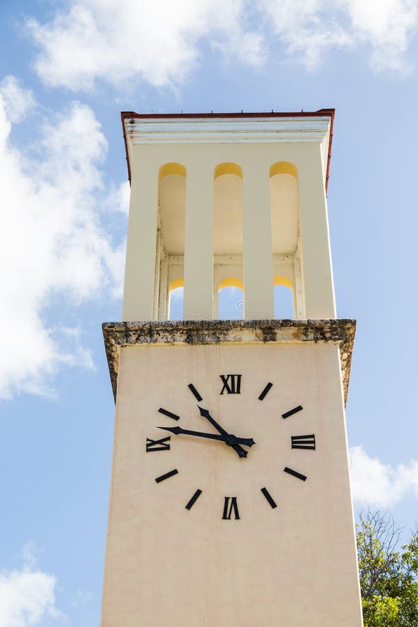 Yellow Stucco Clock Tower stock photo. Image of traditional - 45867108
