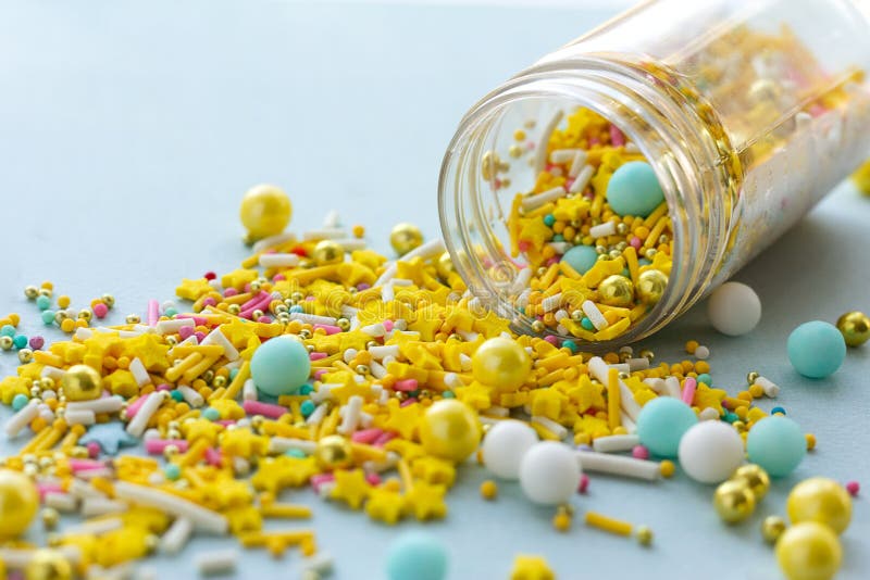 Yellow Sugar Sprinkles Grainy on Blue Background, Close-up Stock Image ...