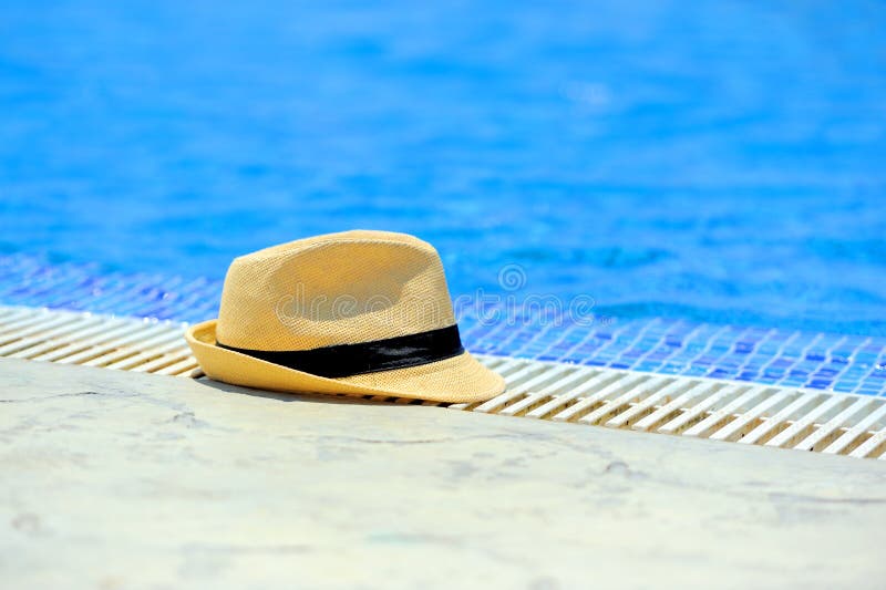 Sun Hat on the Edge of the Pool Stock Photo - Image of summer, pool ...