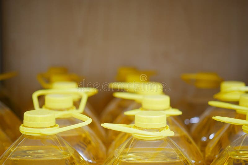 Yellow Sunflower Oil Bottle Lined Up in a Store Stock Image - Image of ...