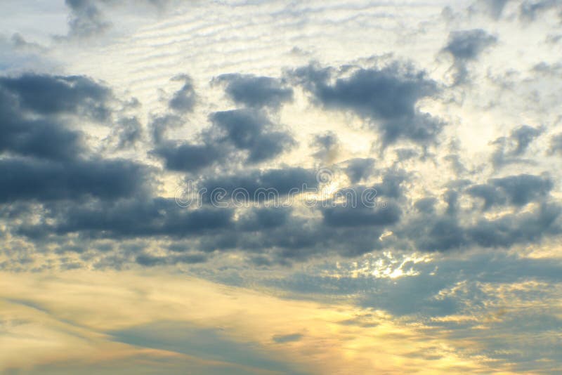 Yellow Sunset with Dark Clouds Above Splotched Over Top Part of Sky ...