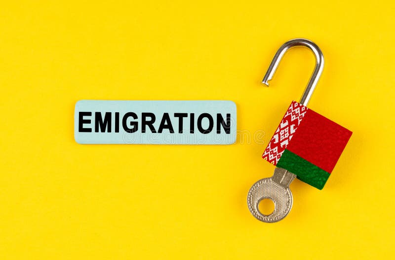 On the Yellow Surface is an Open Lock with a Key and a Sticker with the ...