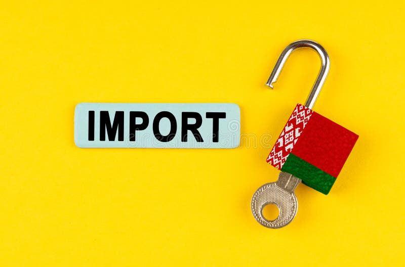 On the Yellow Surface is an Open Lock with a Key and a Sticker with the ...