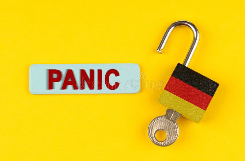 On the Yellow Surface is an Open Lock with a Key and a Sticker with the ...