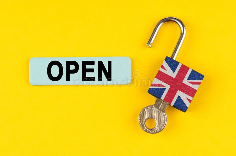 On the Yellow Surface is an Open Lock with a Key and a Sticker with the ...