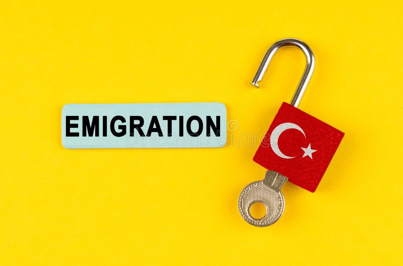 On the Yellow Surface is an Open Lock with a Key and a Sticker with the ...