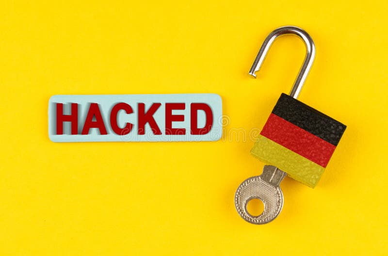 On the Yellow Surface is an Open Lock with a Key and a Sticker with the ...