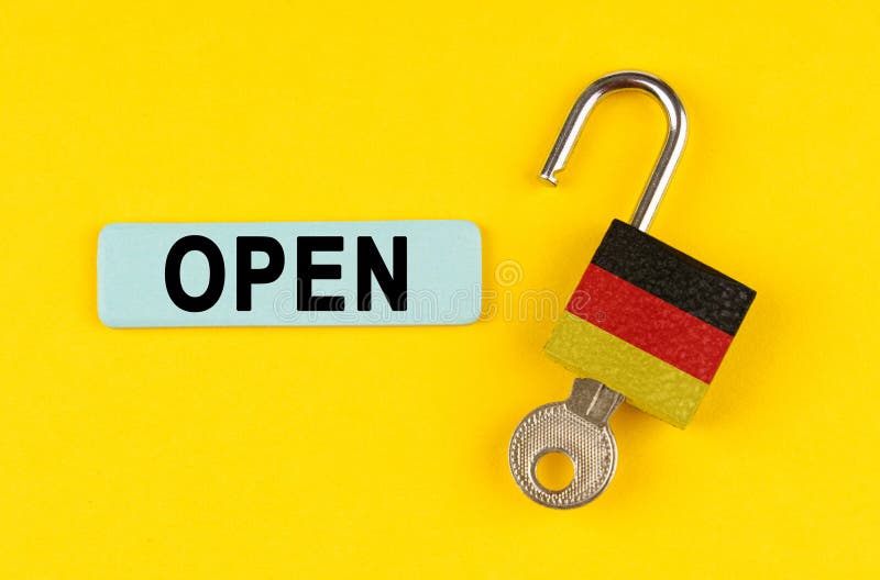 On the Yellow Surface is an Open Lock with a Key and a Sticker with the ...