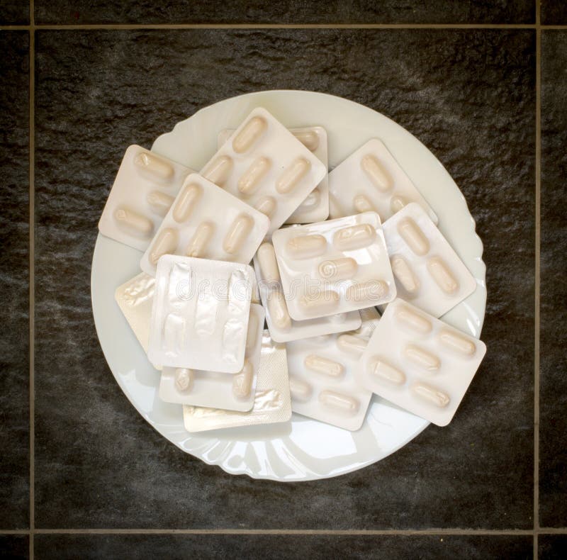 Yellow tablet of fish oil stock image. Image of label - 56447269