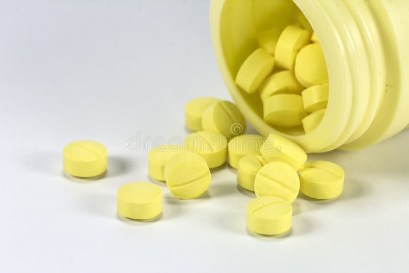 Yellow Tablet and Medicine Yellow Bottle Stock Photo - Image of little ...