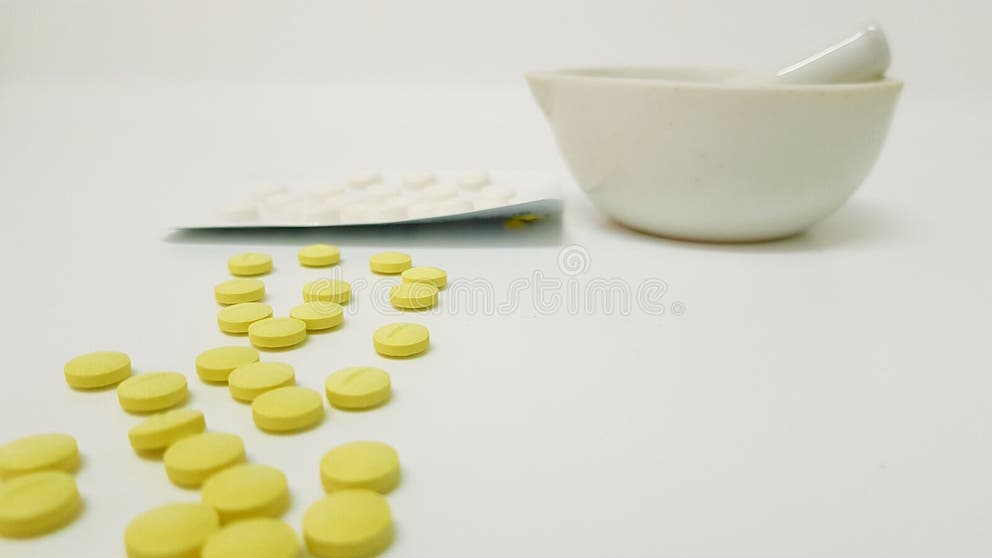 Yellow tablets compounding stock image. Image of tablets - 125352055