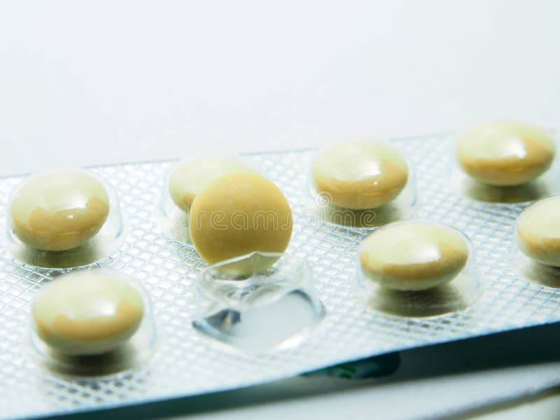 Yellow Tablets, Film-coated, in Plastic Packaging Stock Photo - Image ...