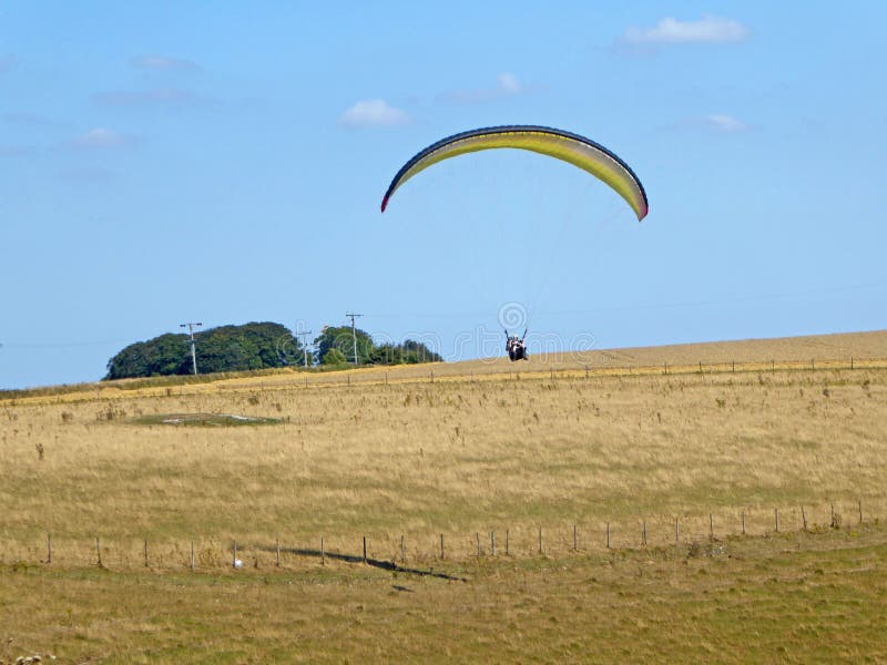 Yellow Paraglider Flying at Mere, Wiltshire Stock Photo - Image of ...
