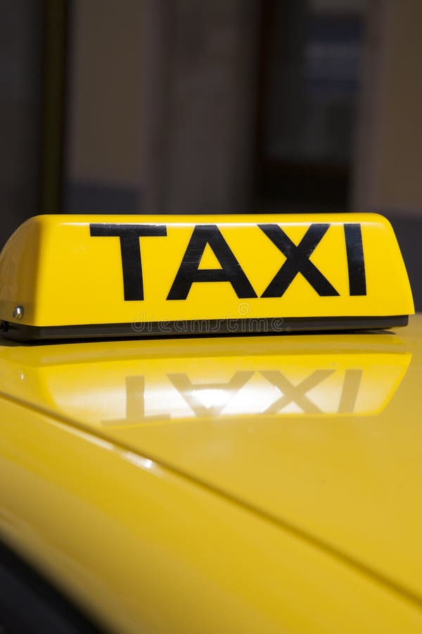 Yellow Taxi Sign stock image. Image of closeup, graphics - 36345701