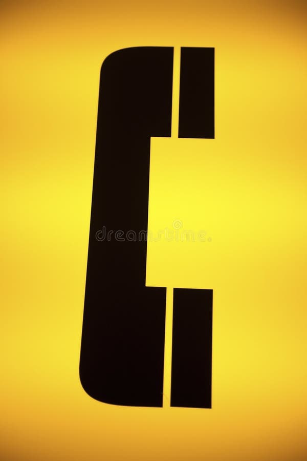 Yellow telephone sign stock photo. Image of iluminated - 24142616