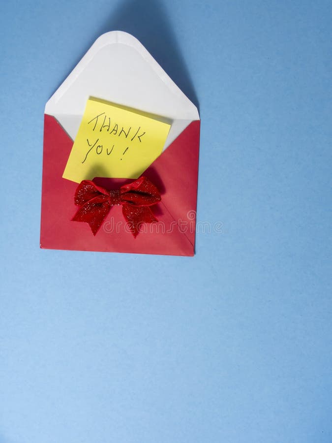 Yellow Thank You Post-it Note on a Red Envelope and Red Bow on a Blue ...