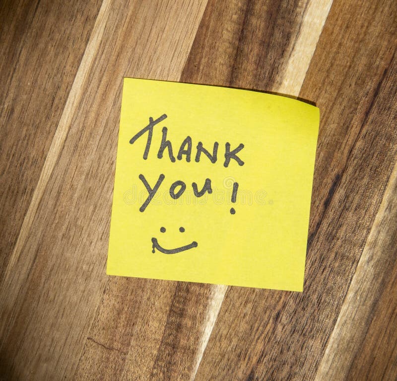 Yellow Thank You Post-it Note with a Smiley Face on a Wooden Background ...