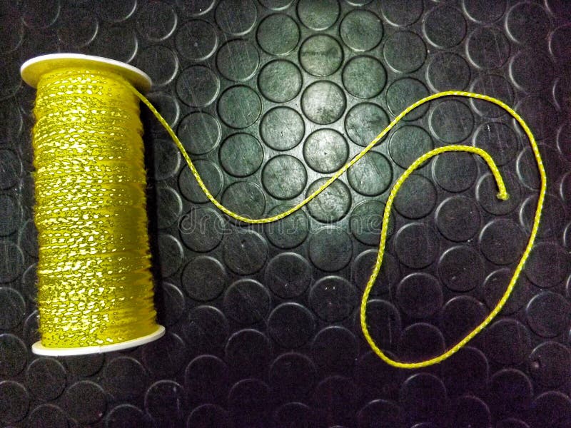 Yellow Thread Spool,on a Black Surface Stock Image - Image of repair ...