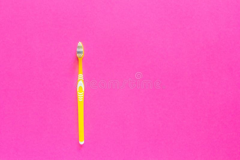 Yellow Toothbrush on a Bright Pink Background Stock Photo - Image of ...