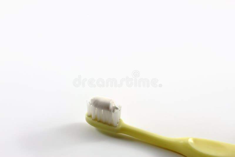A Yellow Toothbrush with Toothpaste Stock Photo - Image of healthcare ...