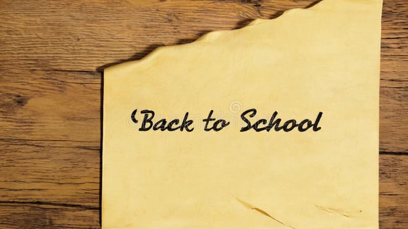 Torn Paper Note with Back To School Written on Wood Surface Stock ...