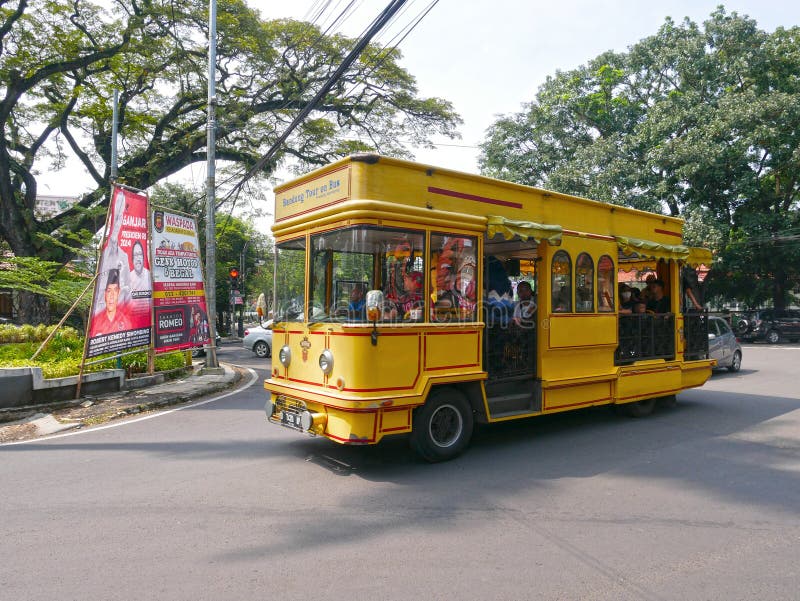 Yellow Tour Bus in Jl. Martadinata in Bandung, Indonesia Stock Image ...
