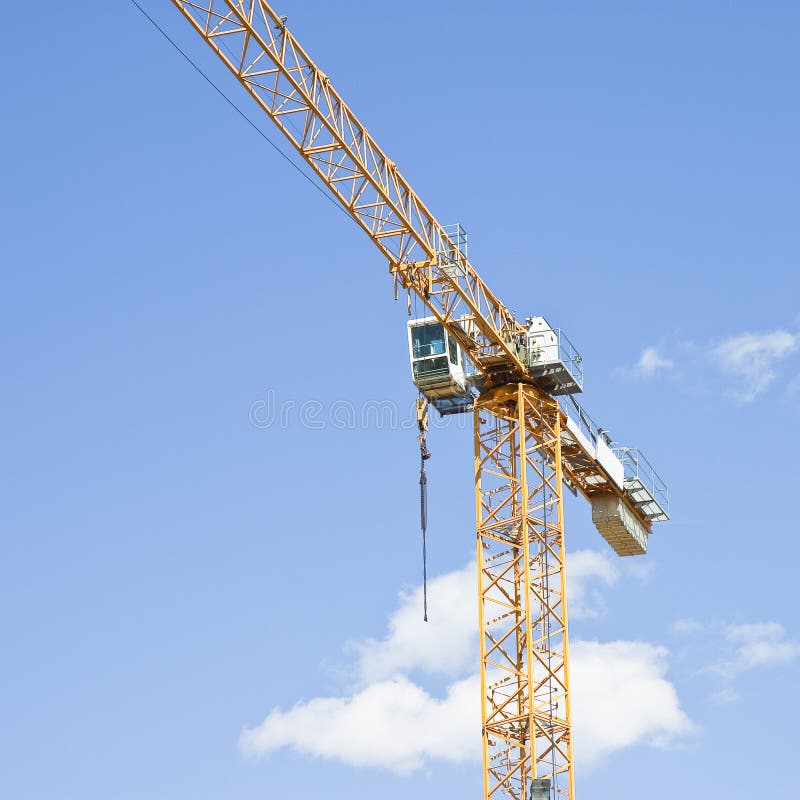 Yellow Tower Crane in a Blue Background Stock Photo - Image of ...