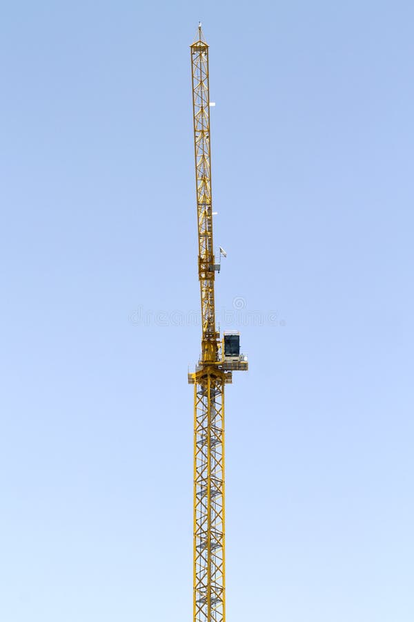 Yellow Tower Crane in Front of Blue Sky Stock Image - Image of vertical ...