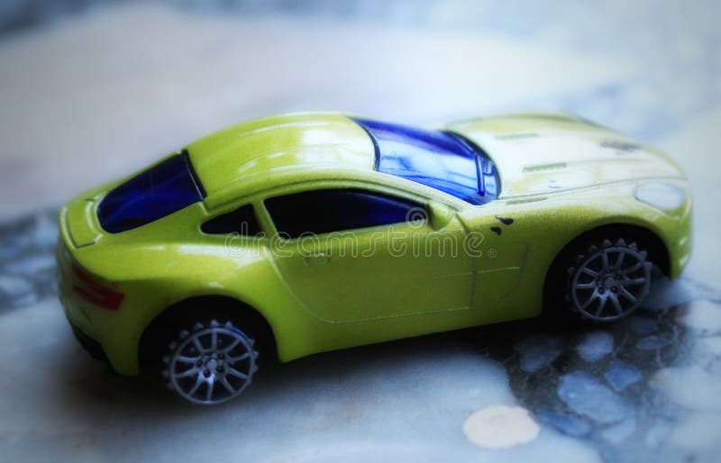 Yellow Toy Car Small Scale Model Stock Photo - Image of still, stills ...