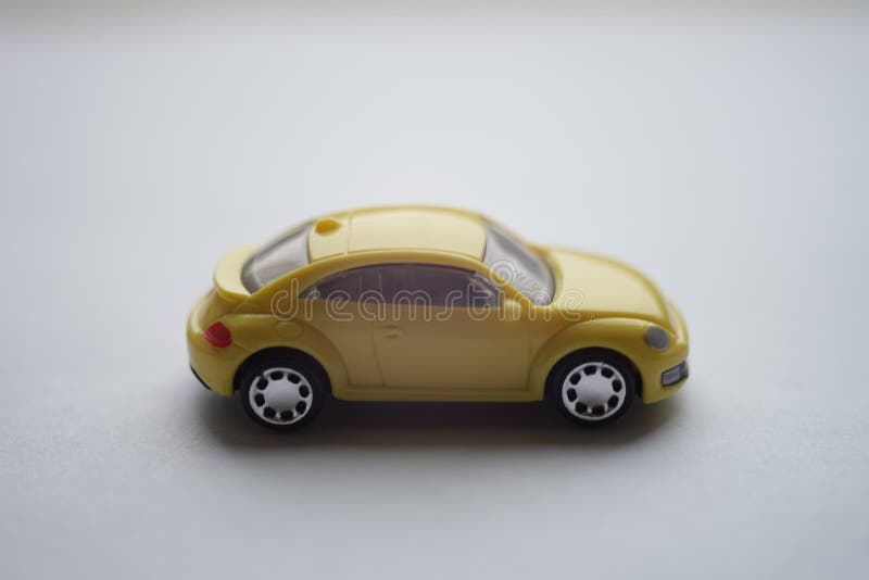 Yellow Toy Car on White Surface, Side View Stock Photo - Image of wheel ...