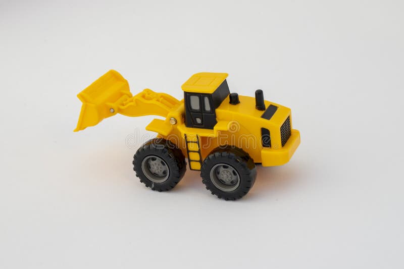 Yellow Toy Front Loader Construction Vehicle Isolated on White ...