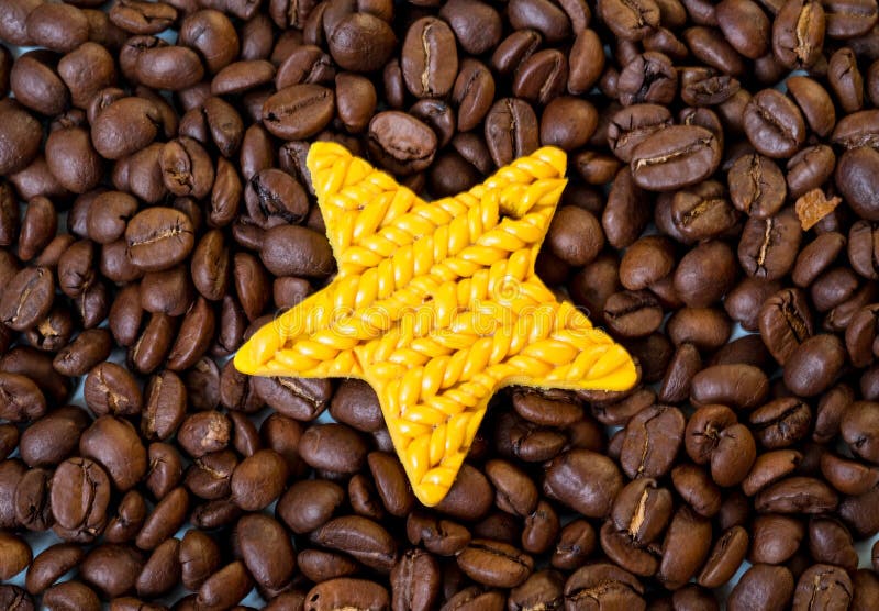 Yellow Toy Star and Coffee Beans Stock Photo - Image of beans, star ...