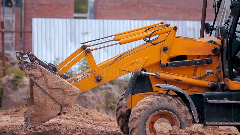 Yellow Tractor on a Construction Site. Professional Construction ...